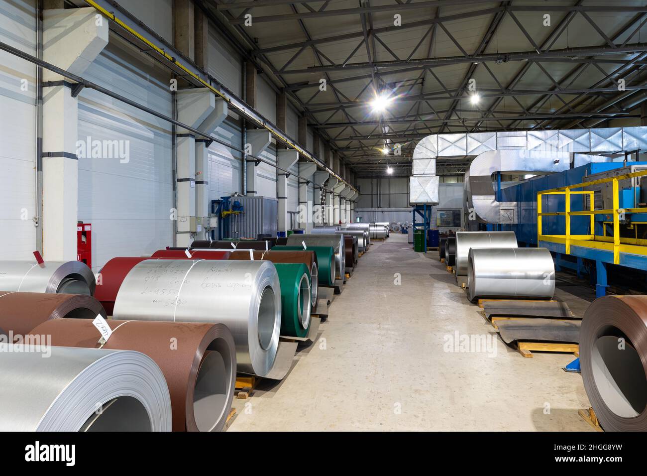 Photo shot of roll of painted galvanized steel sheet at cutting machine ...