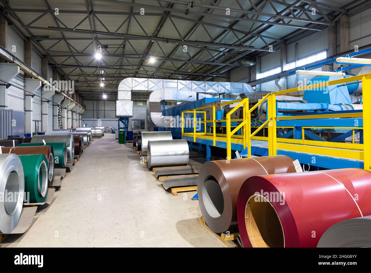 Photo shot of roll of painted galvanized steel sheet at cutting machine ...
