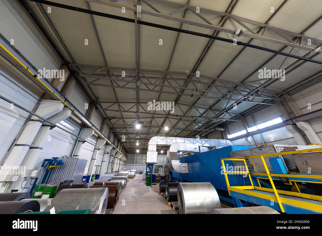 Photo shot of roll of painted galvanized steel sheet at cutting machine ...