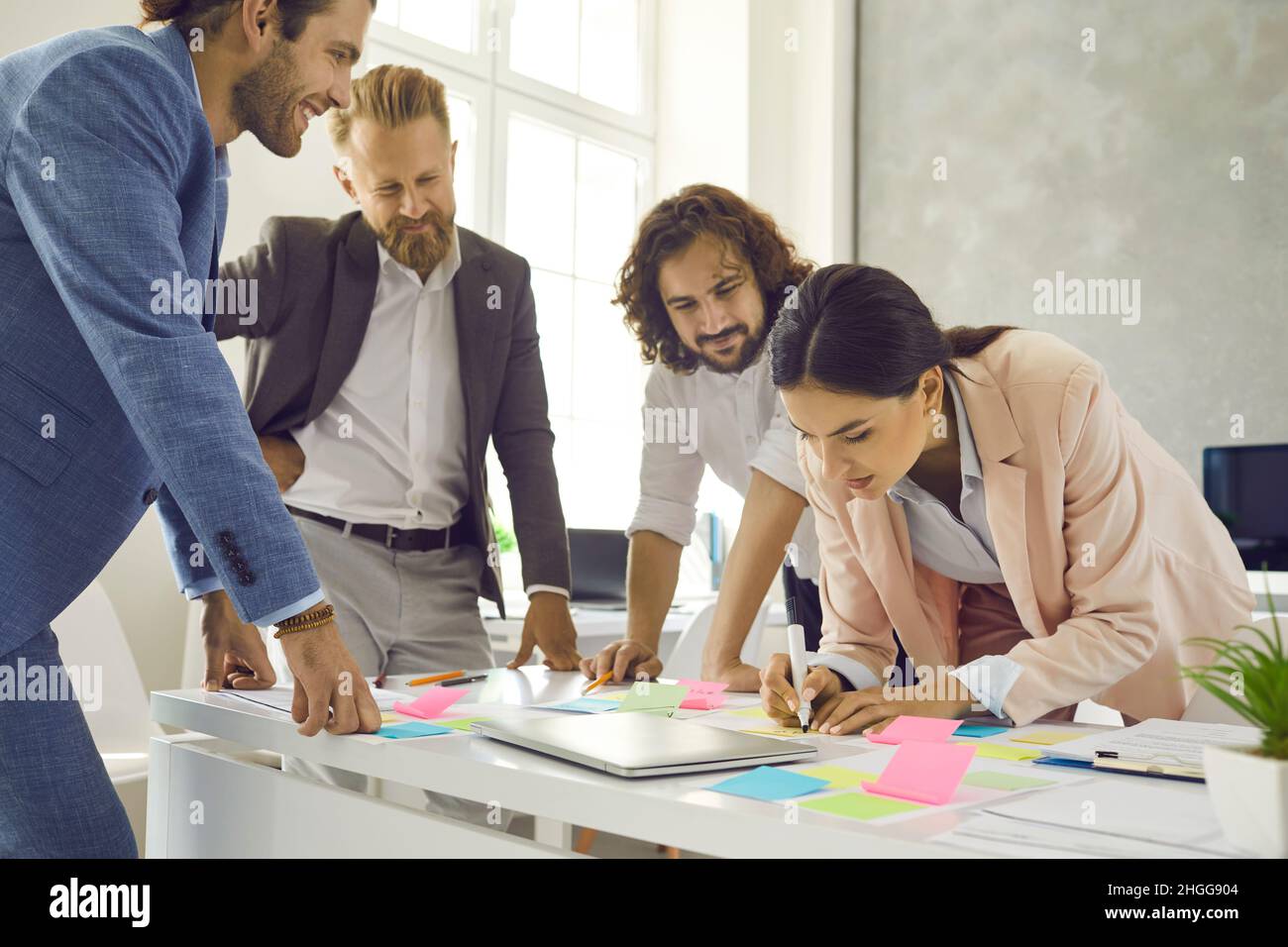 Employees brainstorm engaged in hi-res stock photography and images - Alamy