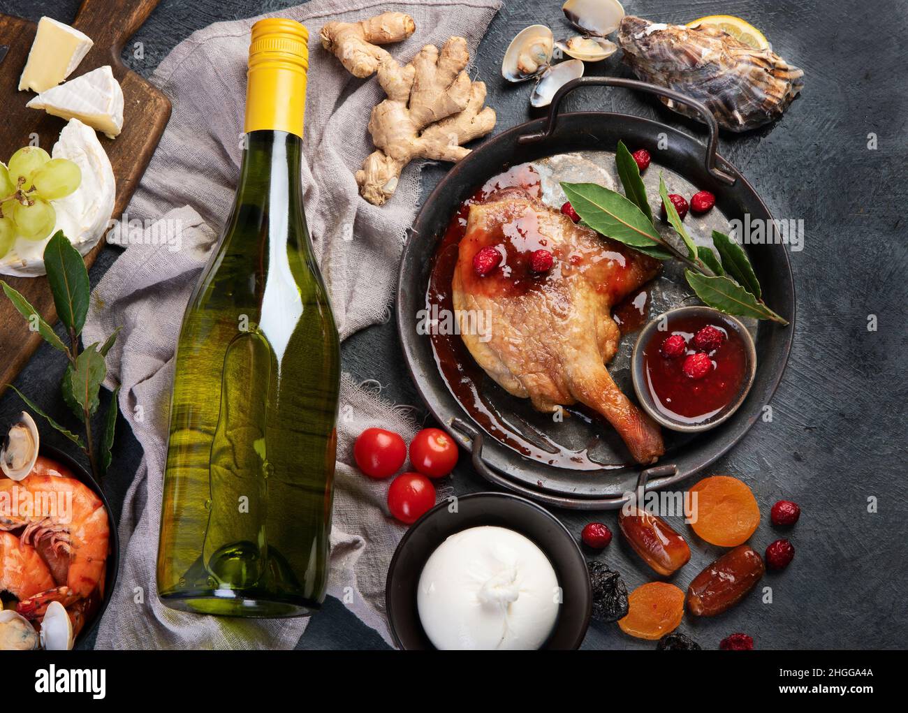 White wine Riesling with duck and snacks. Traditional alcohol drinks ...