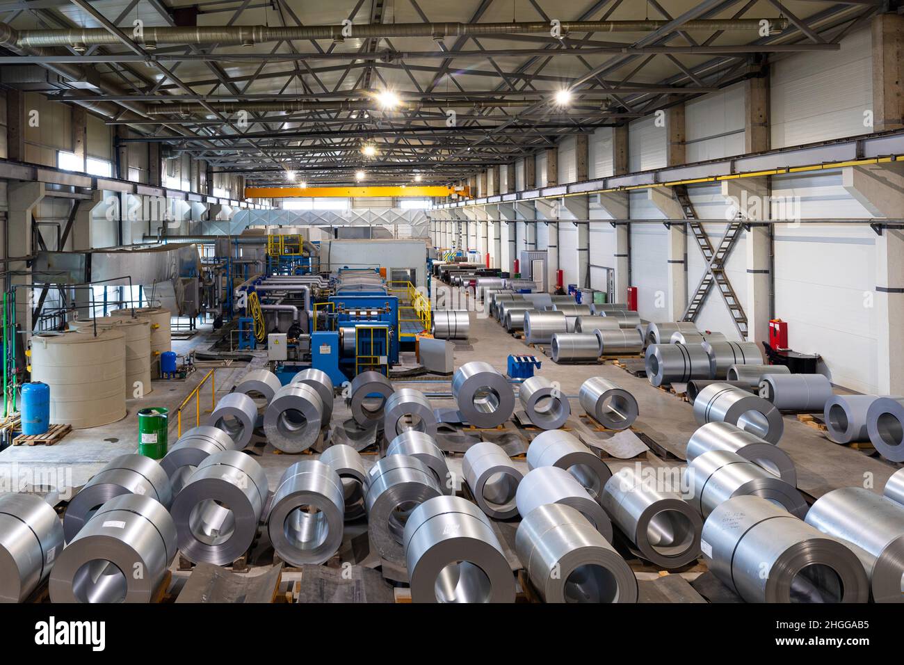 Photo of production line of metal tile for roof. Steel forming machine ...