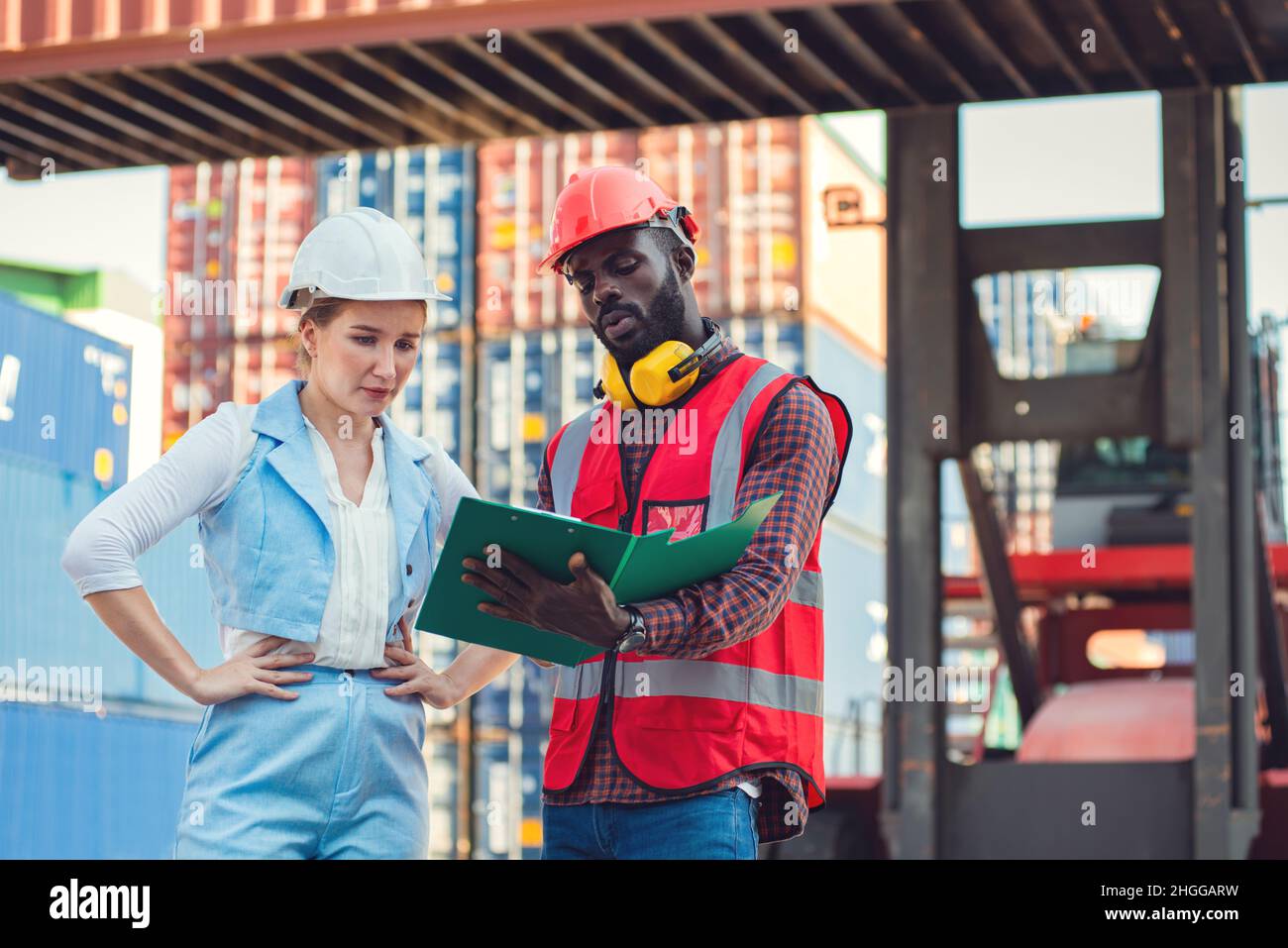 The Problem with businesswoman and engineer talking and checking ...