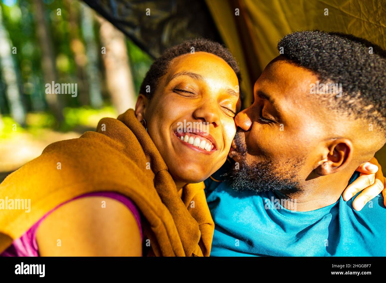 two happy african american people in love spending time outdoors in ...