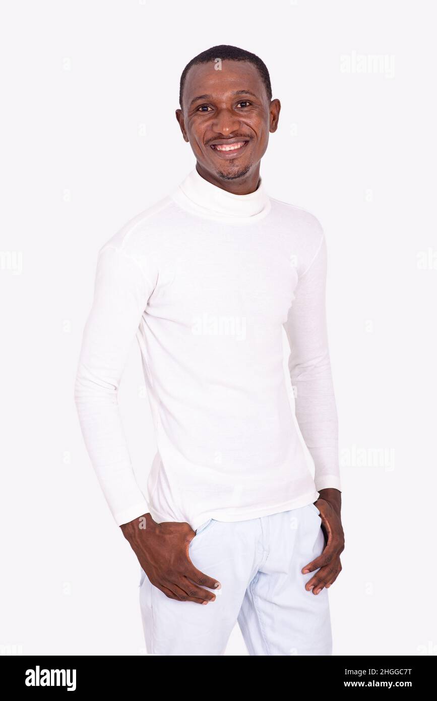 happy adult businessman posing while holding his thumbs in pockets and ...