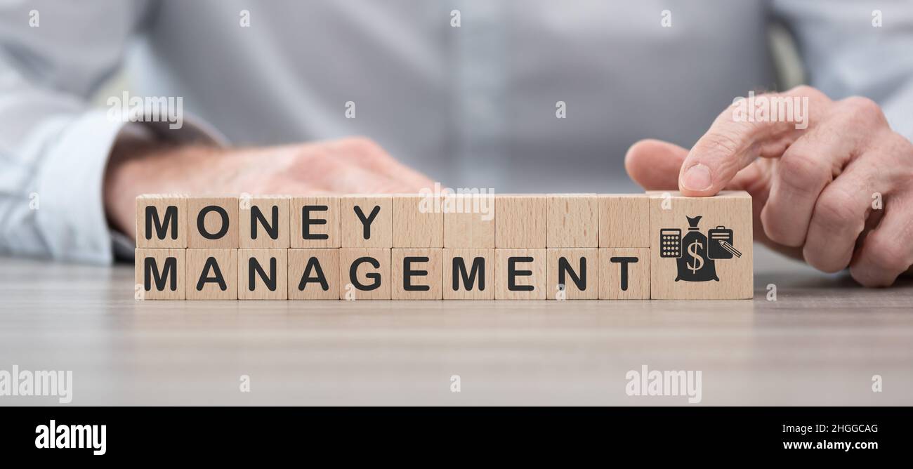 Wooden blocks with symbol of money management concept Stock Photo - Alamy