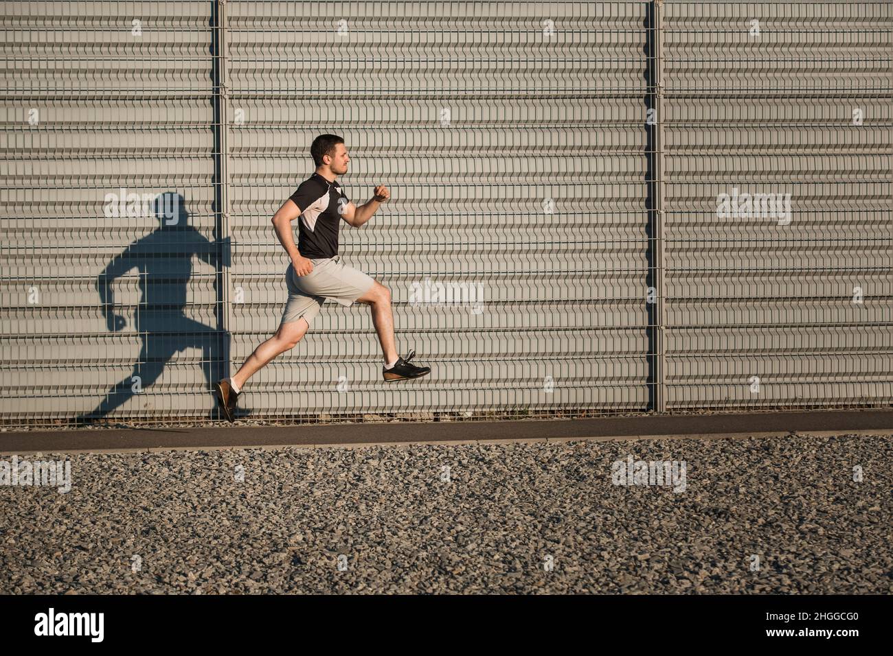 Full length portrait of athletic man running Stock Photo - Alamy