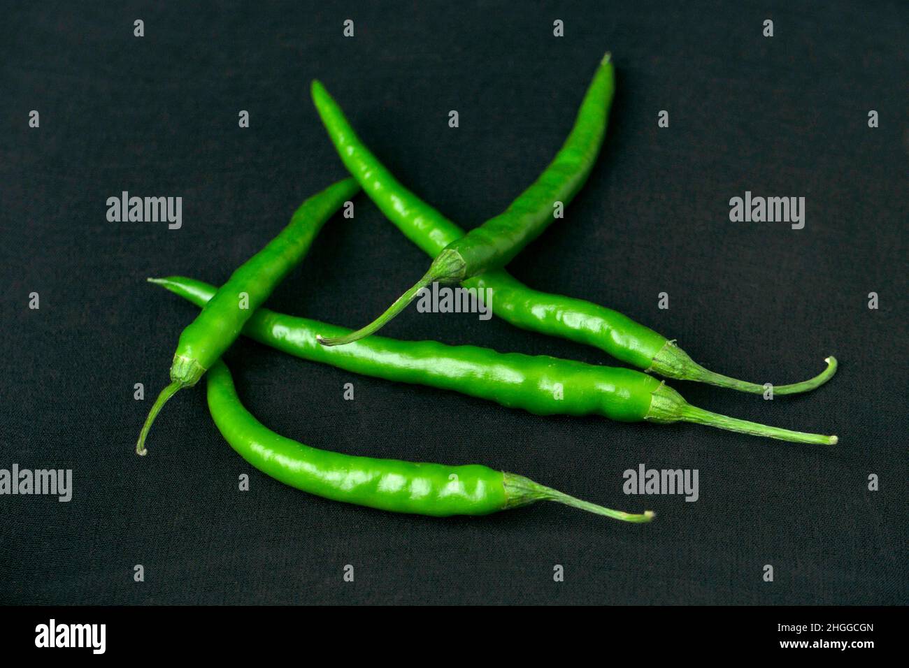 Green capsicum chillies in balck background, Satara, Maharashtra, India ...