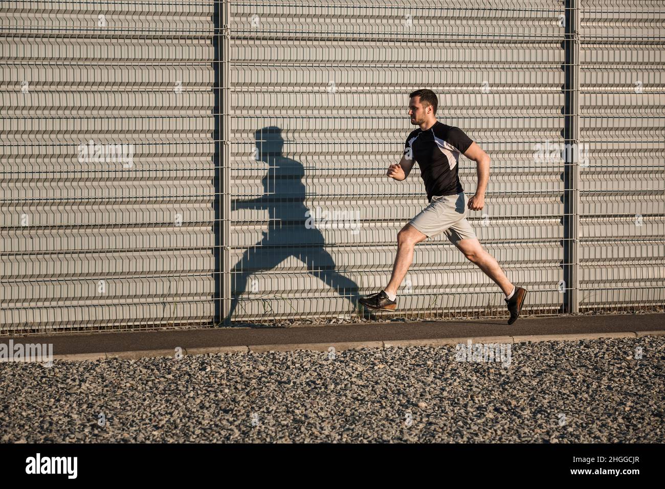 Full length portrait of athletic man running Stock Photo - Alamy