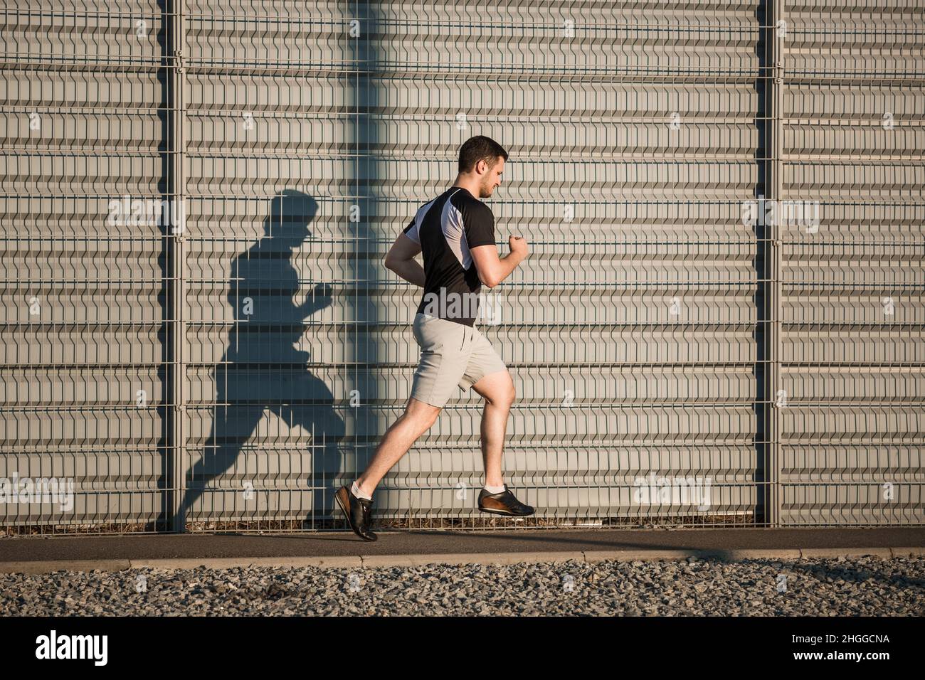 Full length portrait of athletic man running Stock Photo - Alamy