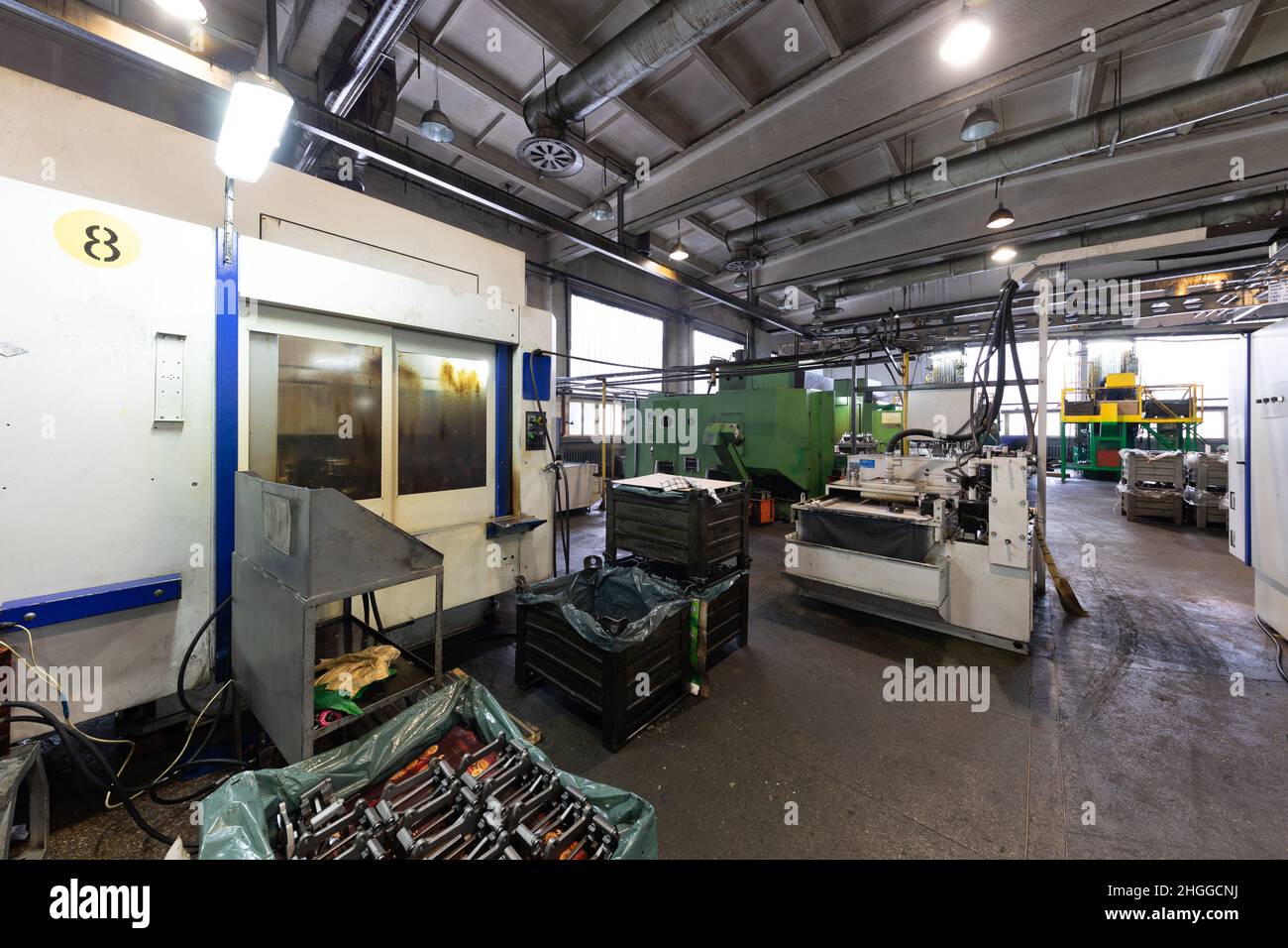 The interior of a big industrial building of factory with steel ...