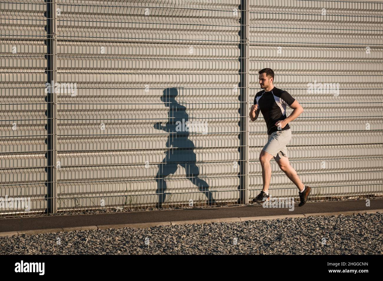 Full length portrait of athletic man running Stock Photo - Alamy