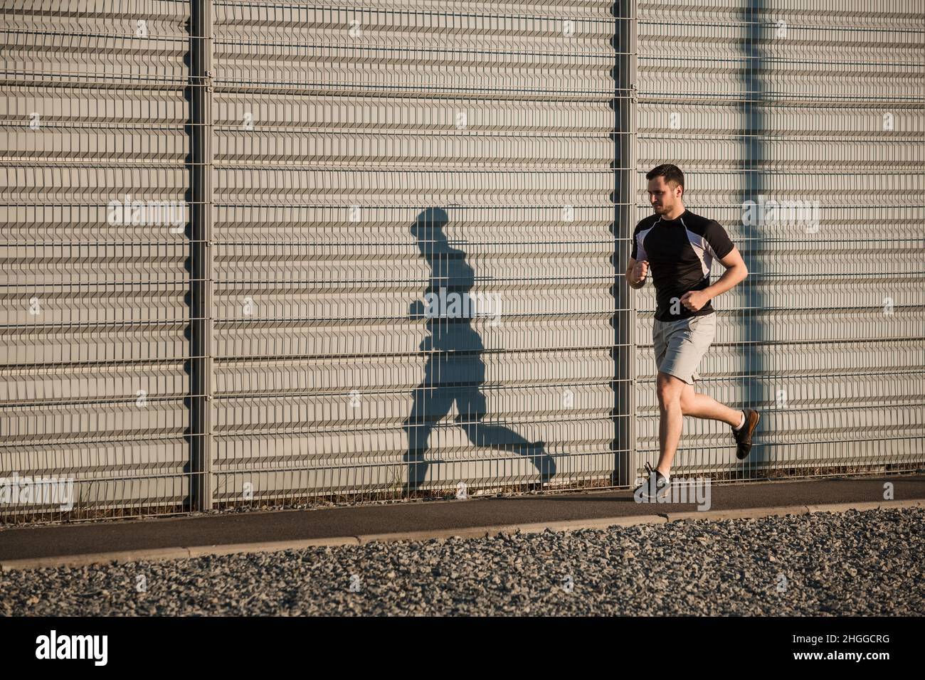 Full length portrait of athletic man running Stock Photo - Alamy