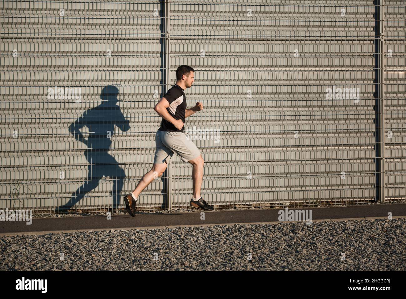 Full length portrait of athletic man running Stock Photo - Alamy