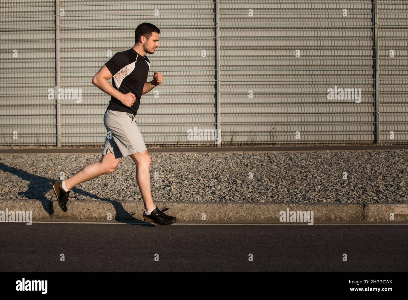 Full length portrait of athletic man running Stock Photo - Alamy
