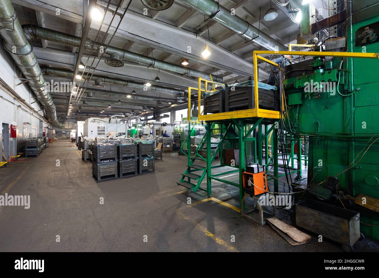 The interior of a big industrial building of factory with steel ...