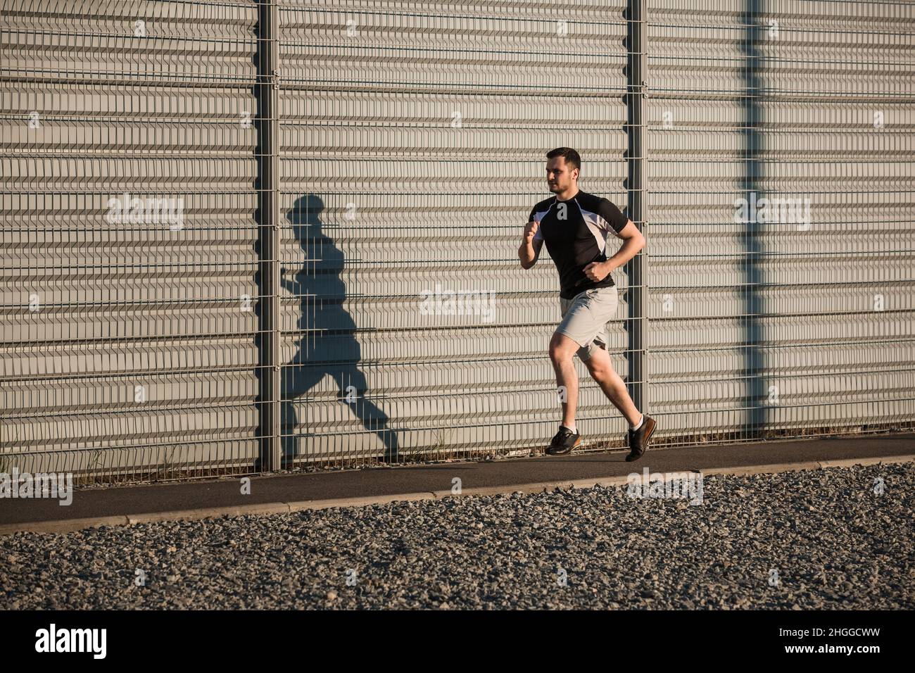 Full length portrait of athletic man running Stock Photo - Alamy