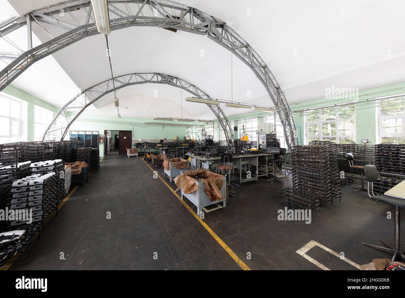 Photo of automobile assembly production. Factory with steel ...