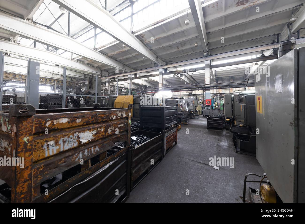The interior of a big industrial building of factory with steel ...