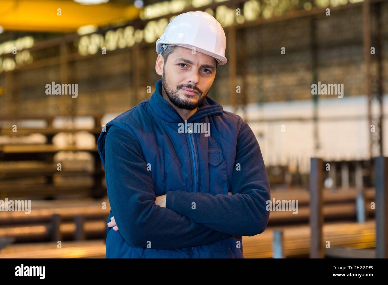 young man working at a factory Stock Photo - Alamy