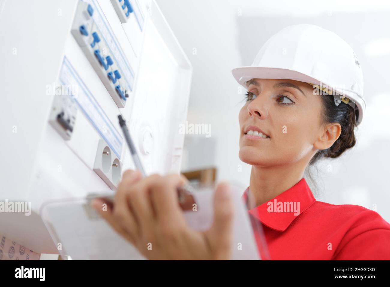 woman reading the electrical current measurements Stock Photo - Alamy