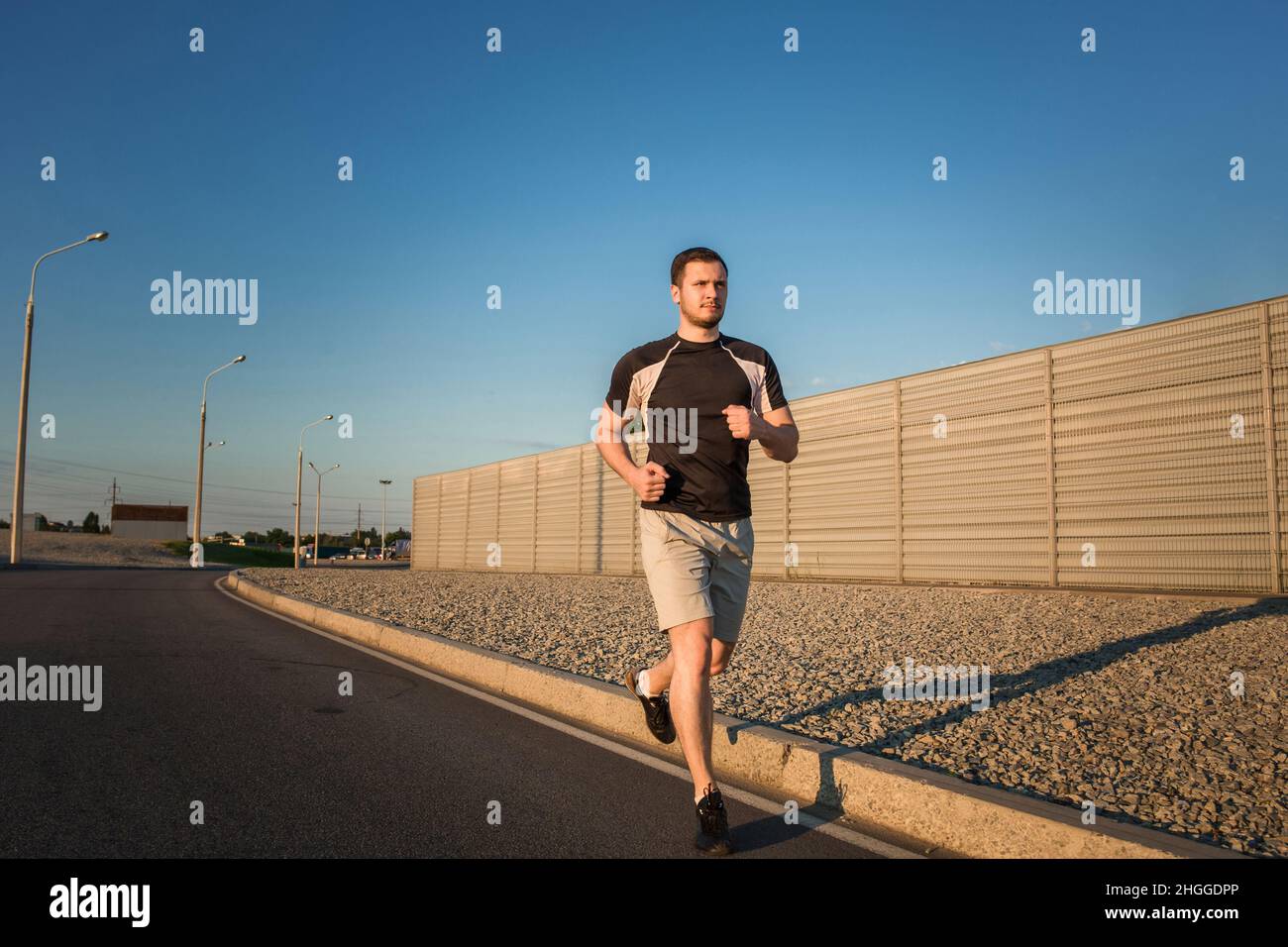 Full length portrait of athletic man running Stock Photo - Alamy