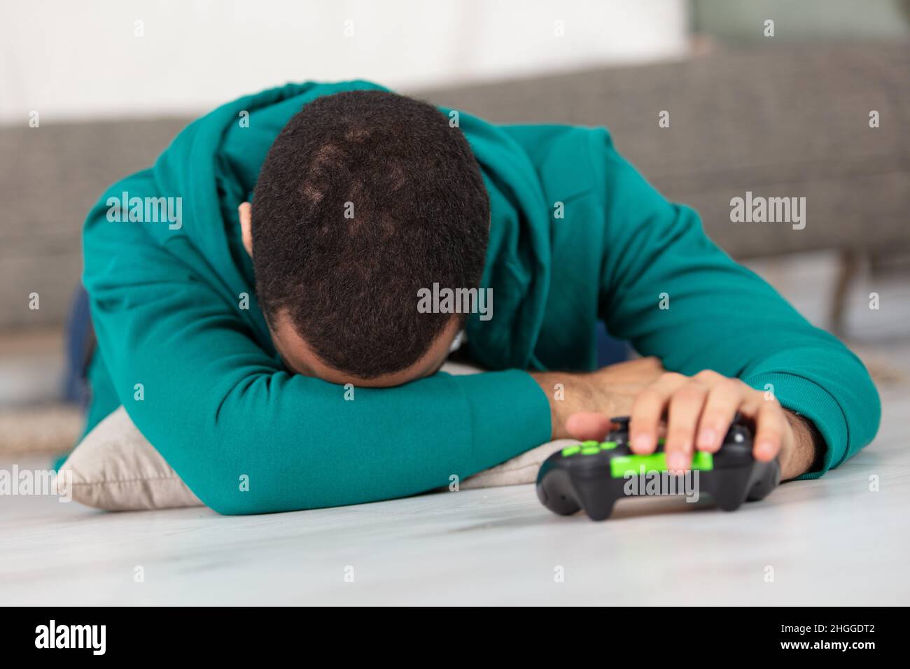 sad man with gamepad in hands playing video game Stock Photo - Alamy
