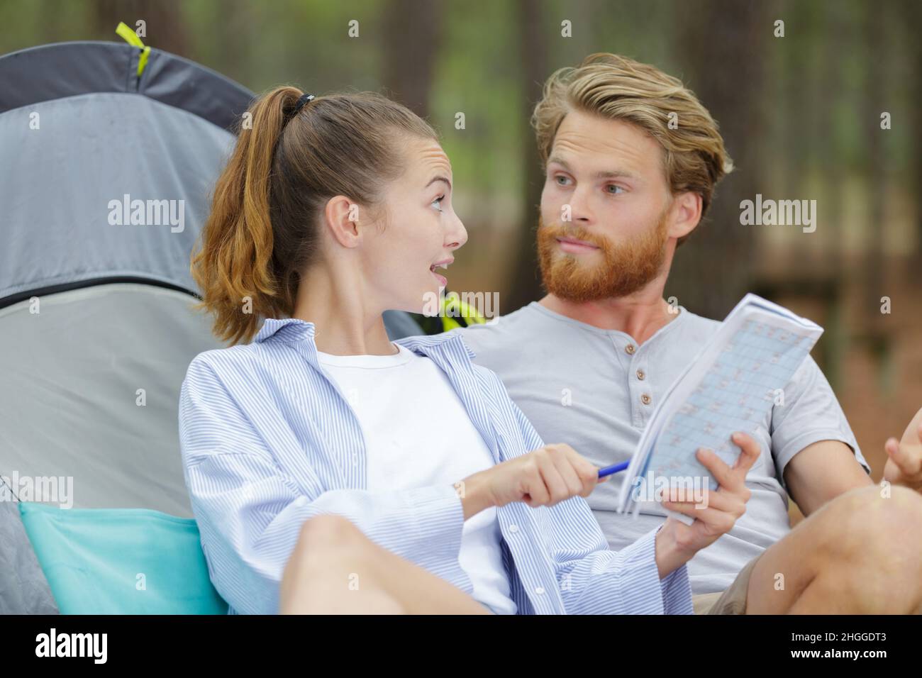 girlfriend talking to boyfriend outside the tent Stock Photo - Alamy