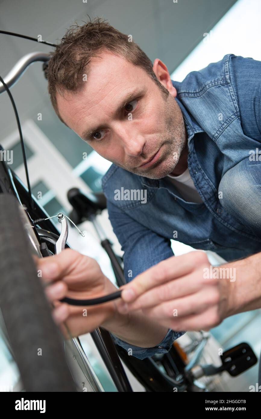 man and the bicycle service Stock Photo - Alamy