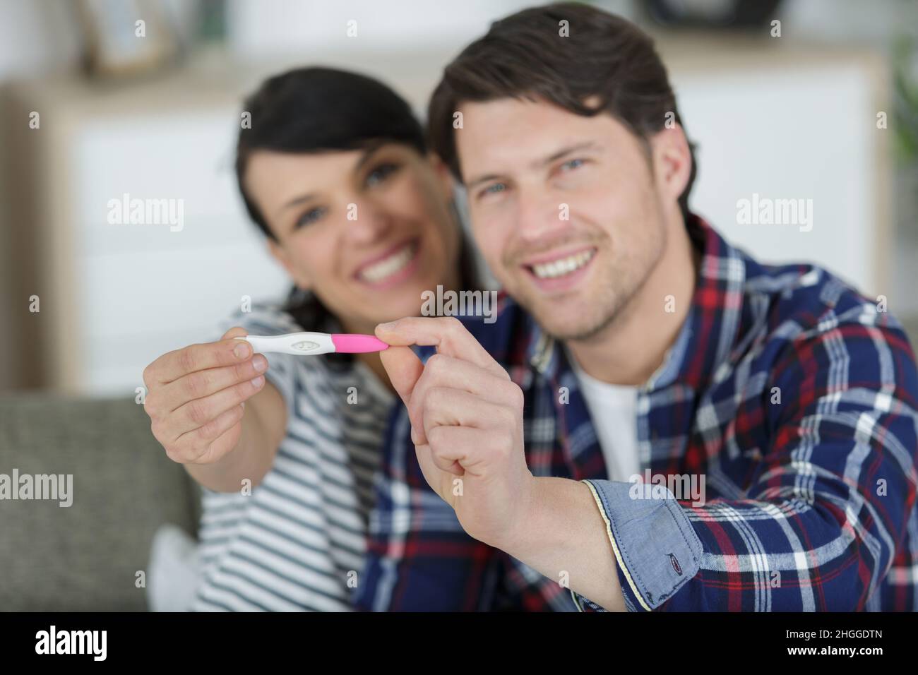 happy couple with positive pregnancy test Stock Photo - Alamy