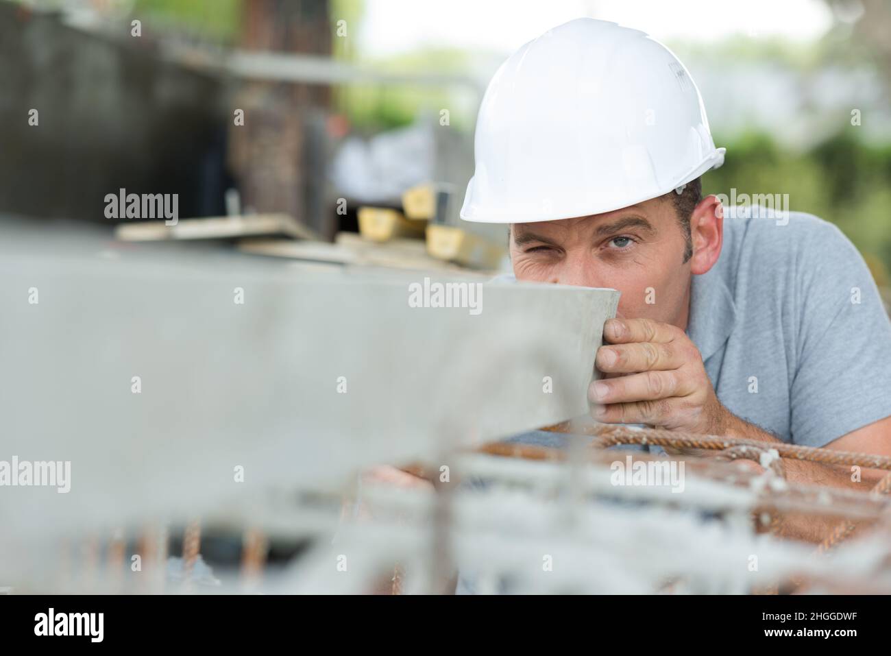 handsome engineer man worker looking a metal structure Stock Photo - Alamy