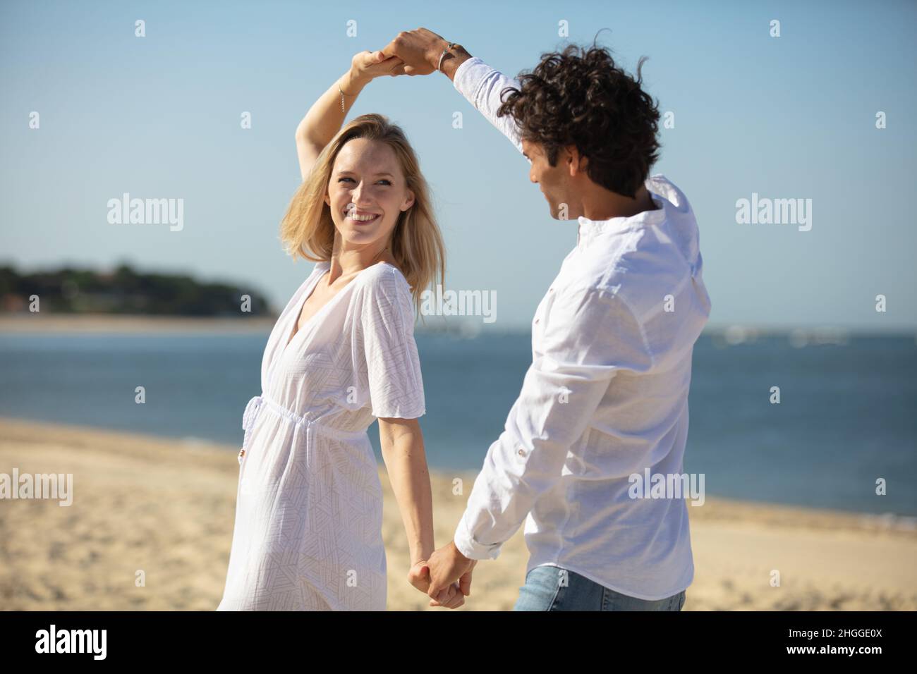 happy couple dancing on the beach Stock Photo - Alamy