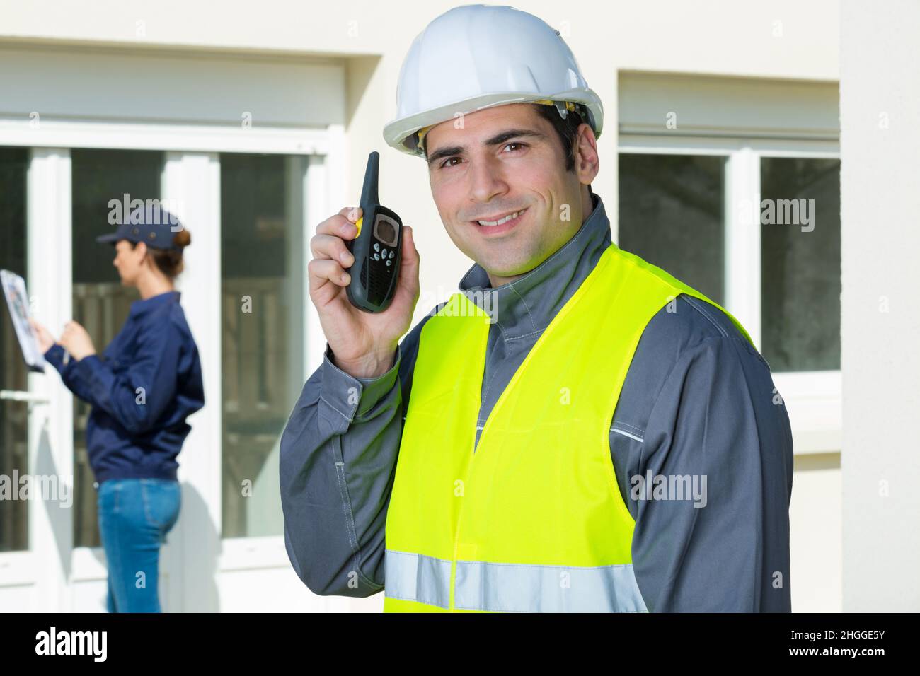 picture of construction foreman using walkie talkie Stock Photo - Alamy