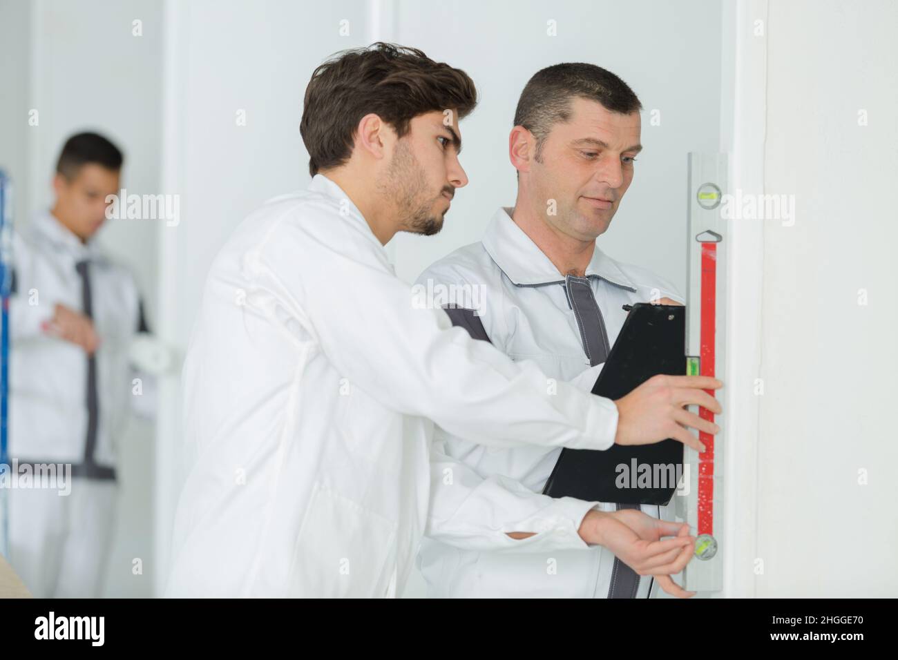 contractors checking the wall angles Stock Photo - Alamy