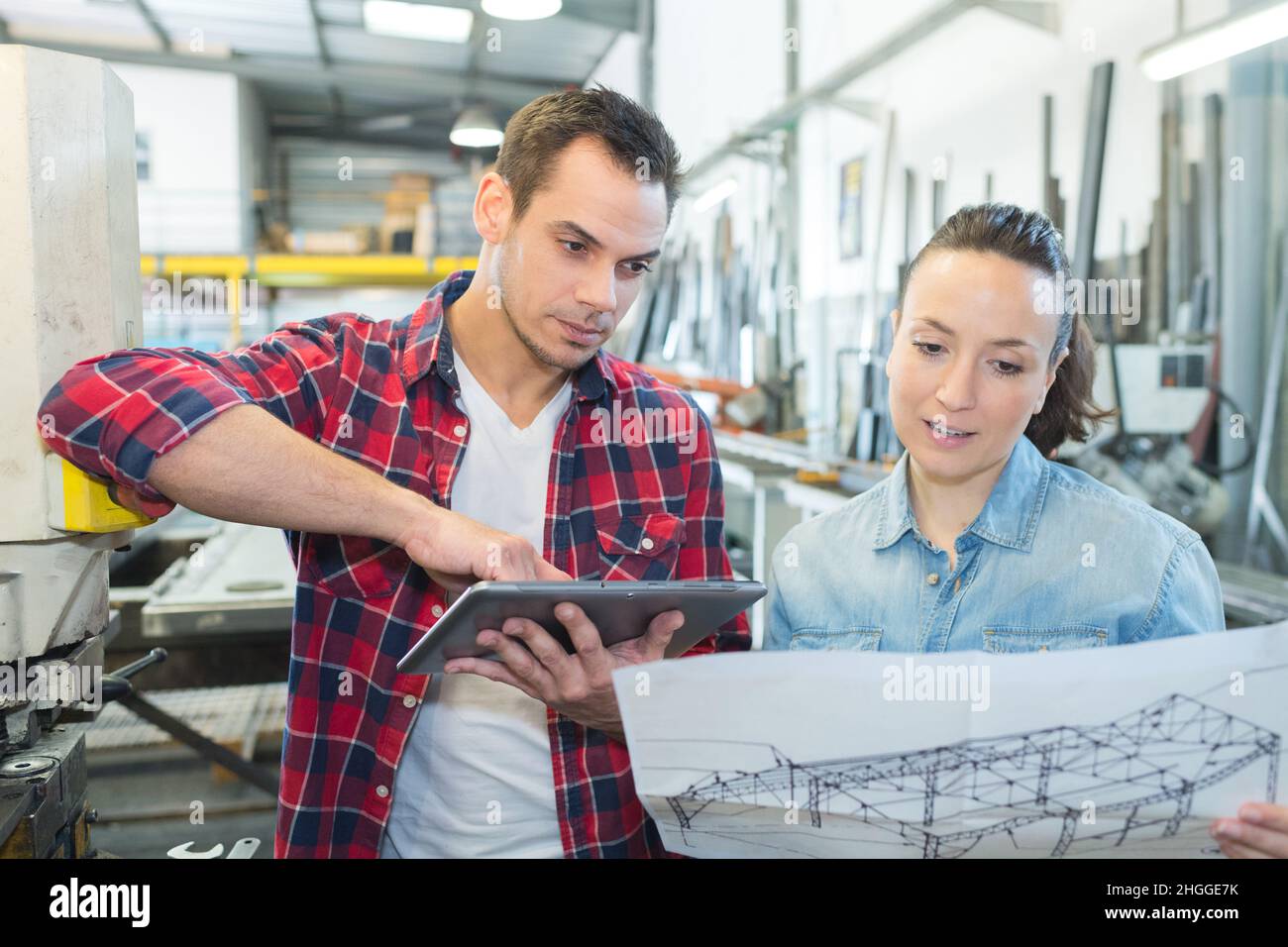 working engineers with factory plans Stock Photo - Alamy