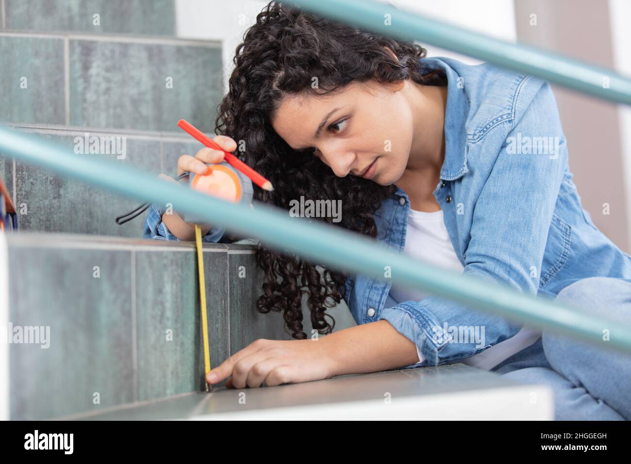 happy woman with level measurement Stock Photo - Alamy