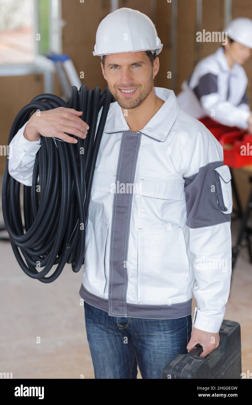 Professional electrician doing socket installation hi-res stock ...