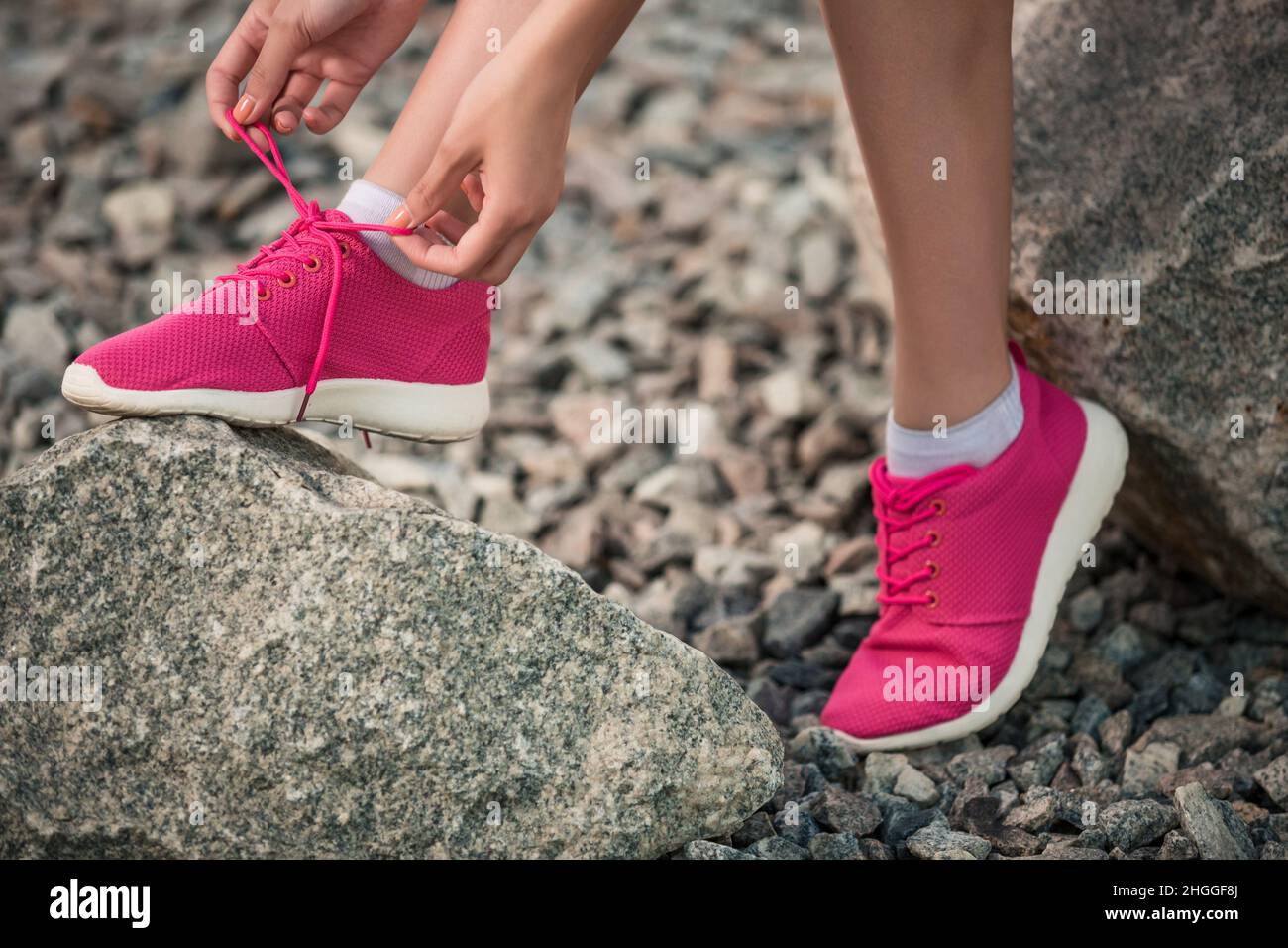 Running shoes - woman tying shoe laces Stock Photo - Alamy