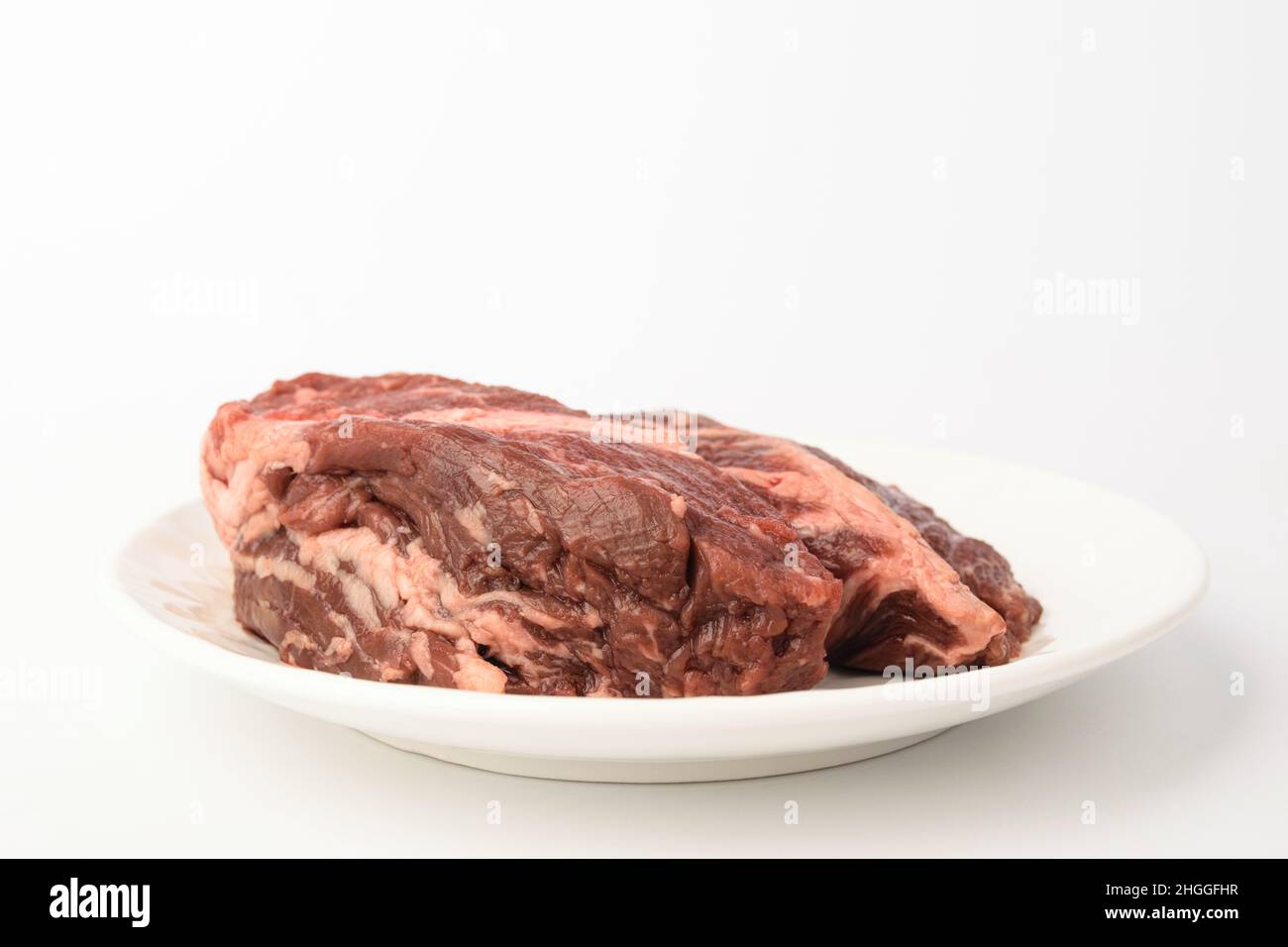 Beef front leg on white background Stock Photo - Alamy