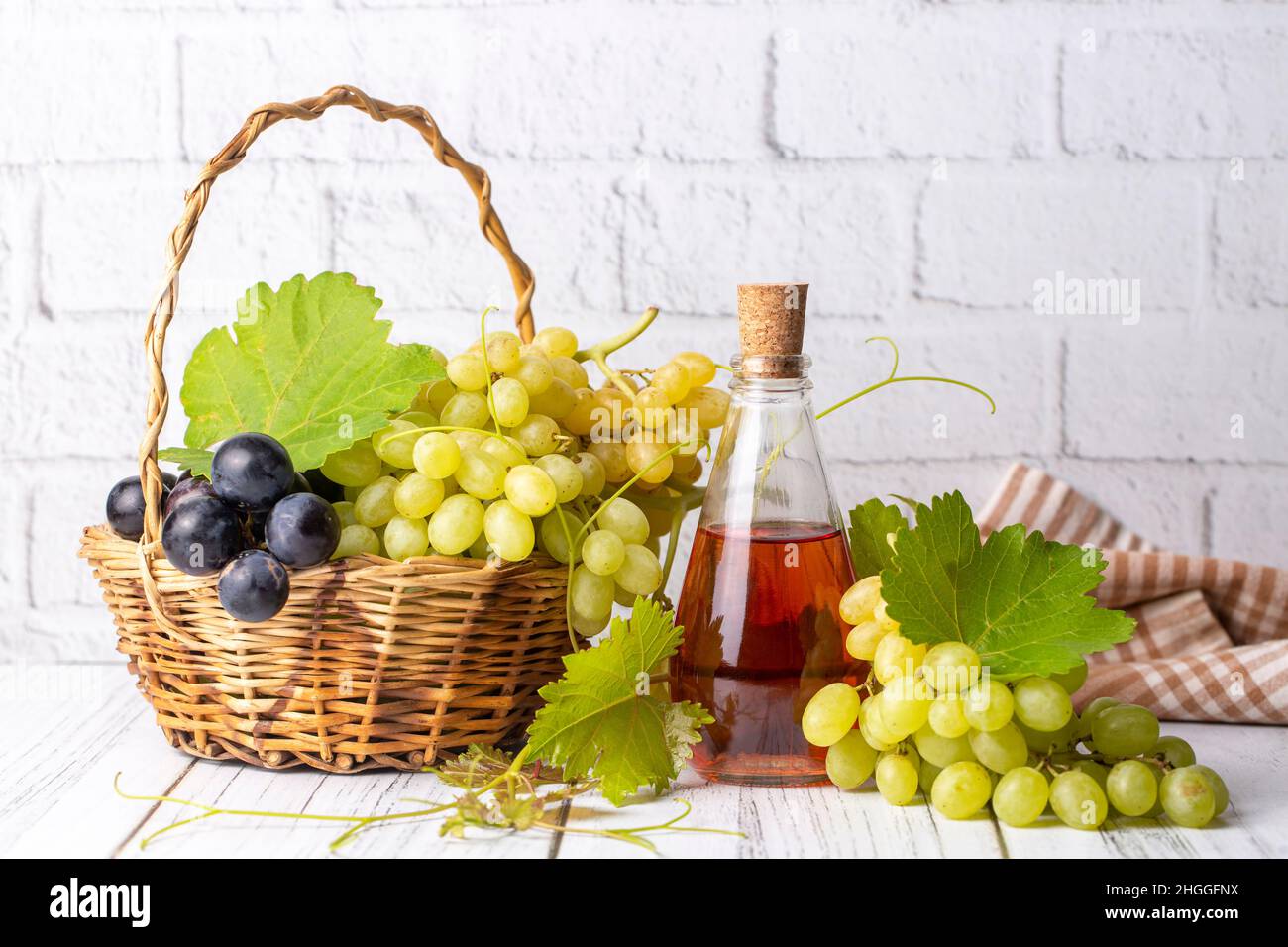 Wine vinegar in a glass jug, dark vintage wooden background, selective ...