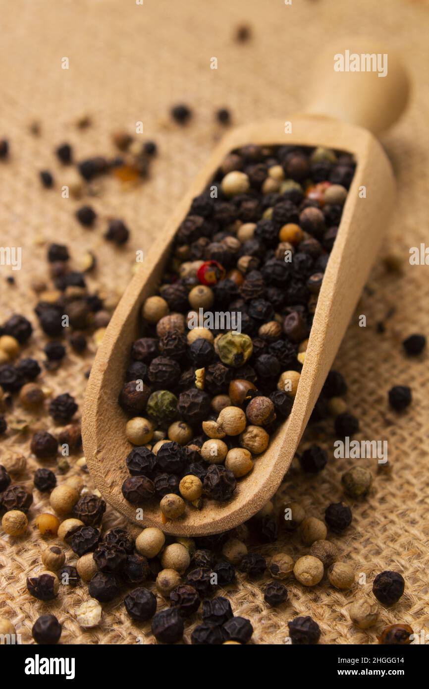 Different peppercorns on wooden hi-res stock photography and images - Alamy