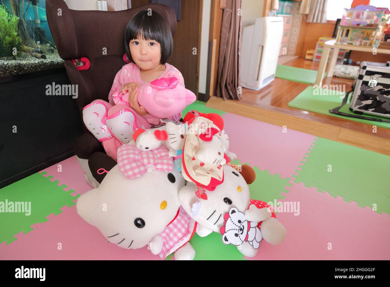 Child at Home with Her Favorite Cute Hello Kitty Stuffed Toys Stock ...