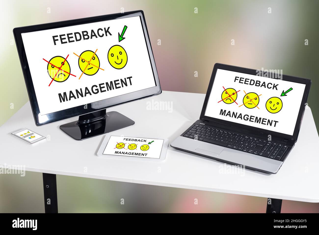 Feedback management concept shown on different information technology ...