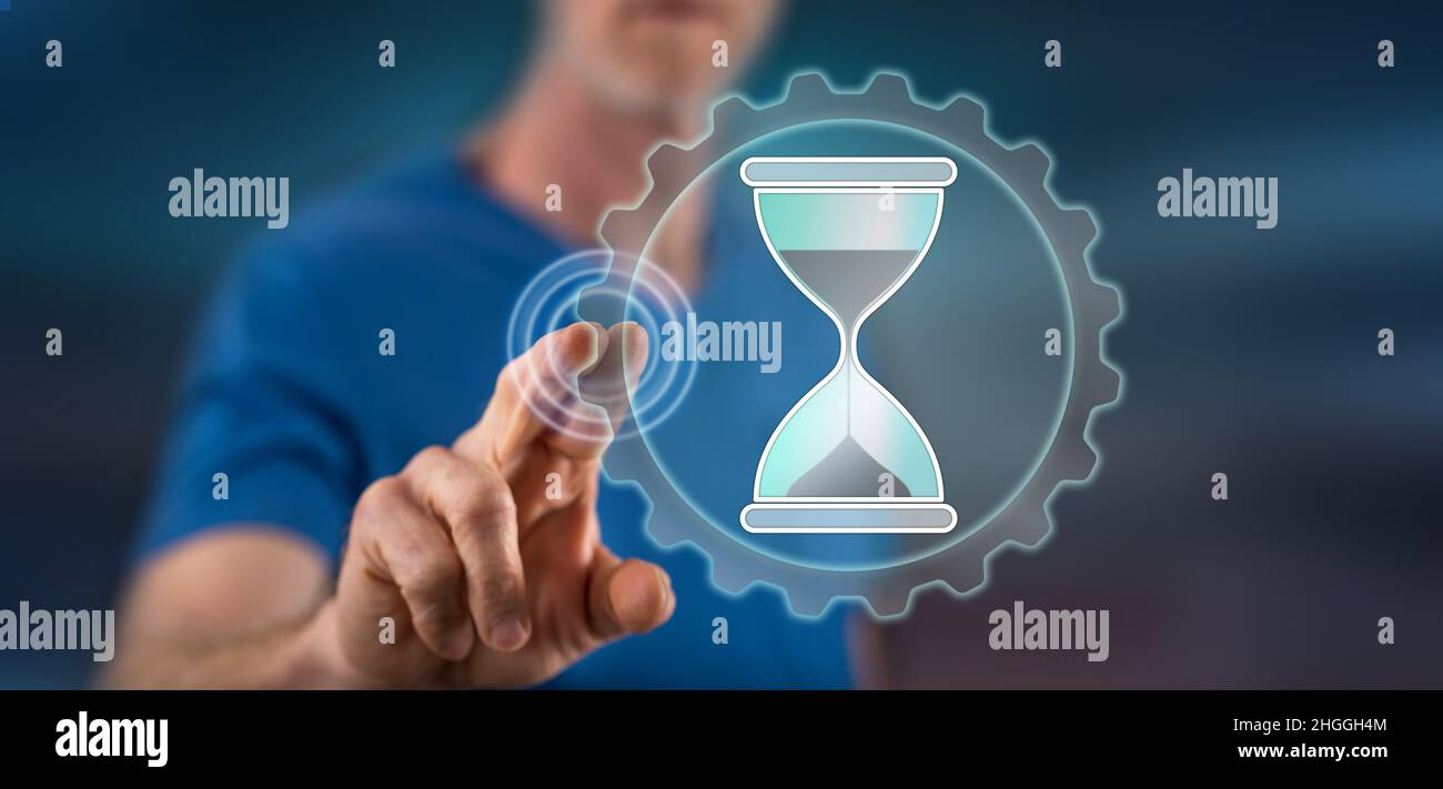 Man touching a time management concept on a touch screen with his ...