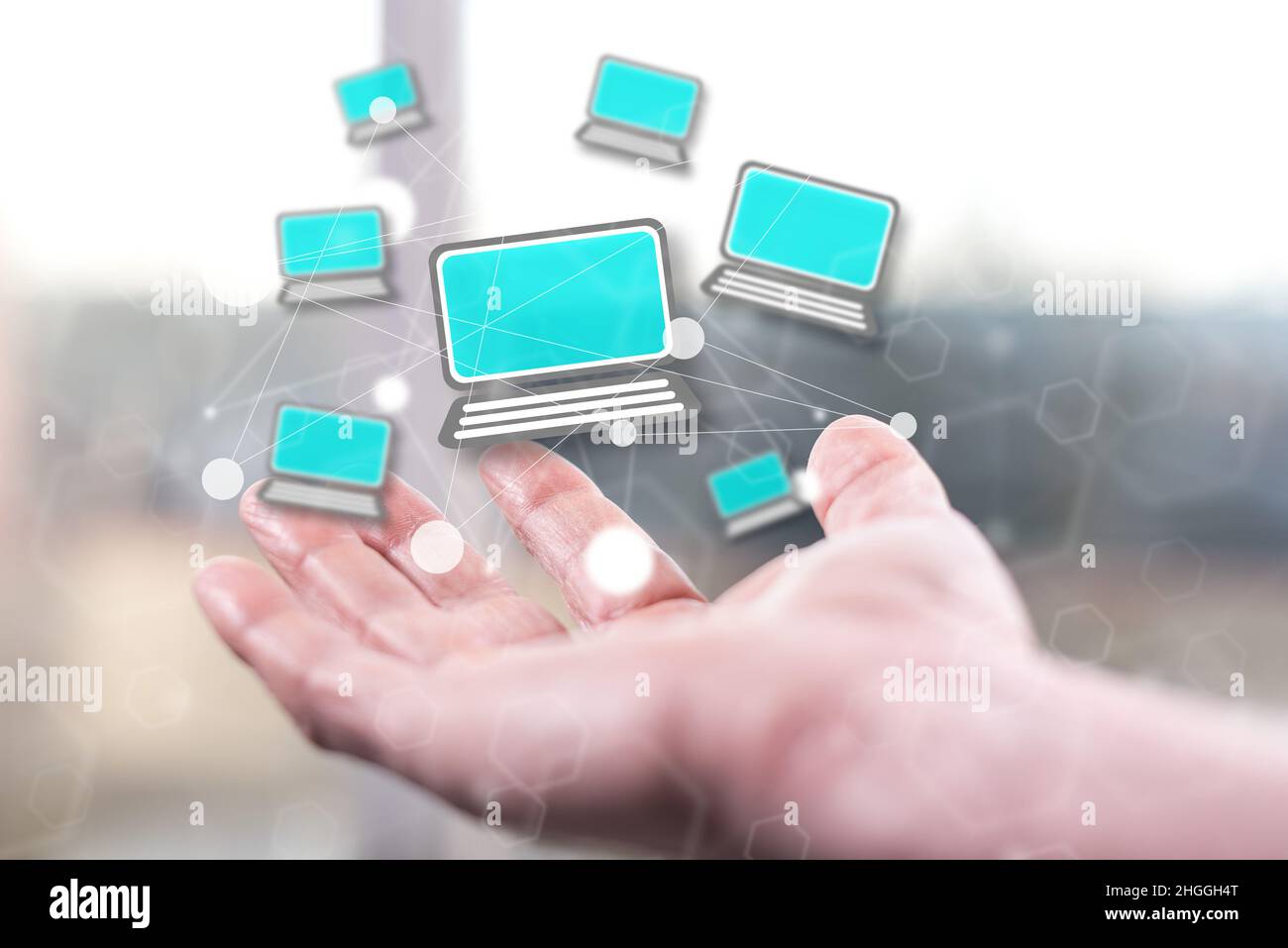Devices connection concept above a hand of a man Stock Photo - Alamy