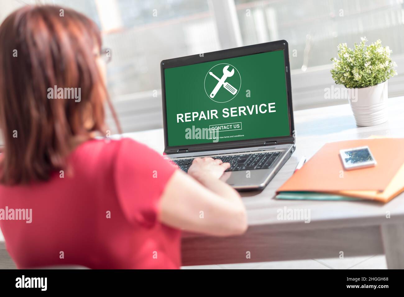 Laptop screen displaying a repair service concept Stock Photo - Alamy