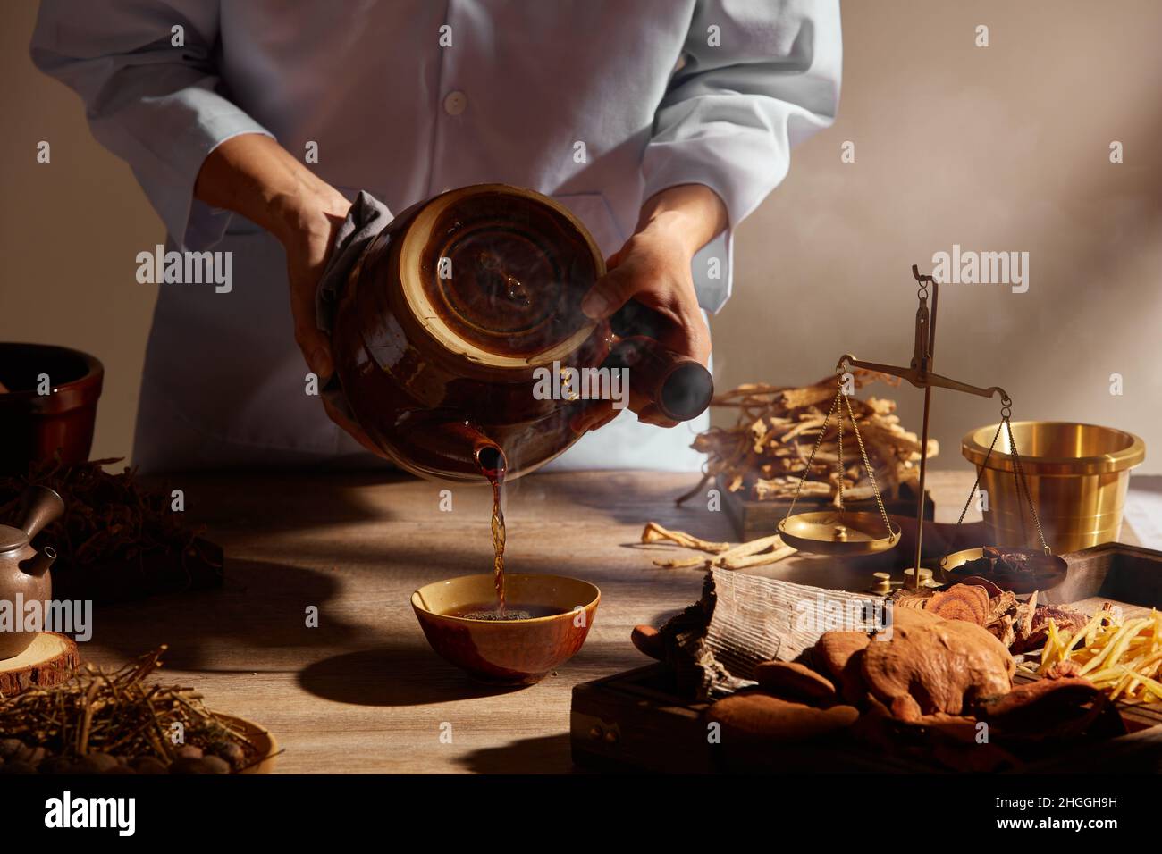 Traditional chinese medicine with herb and spices in brown wooden ...