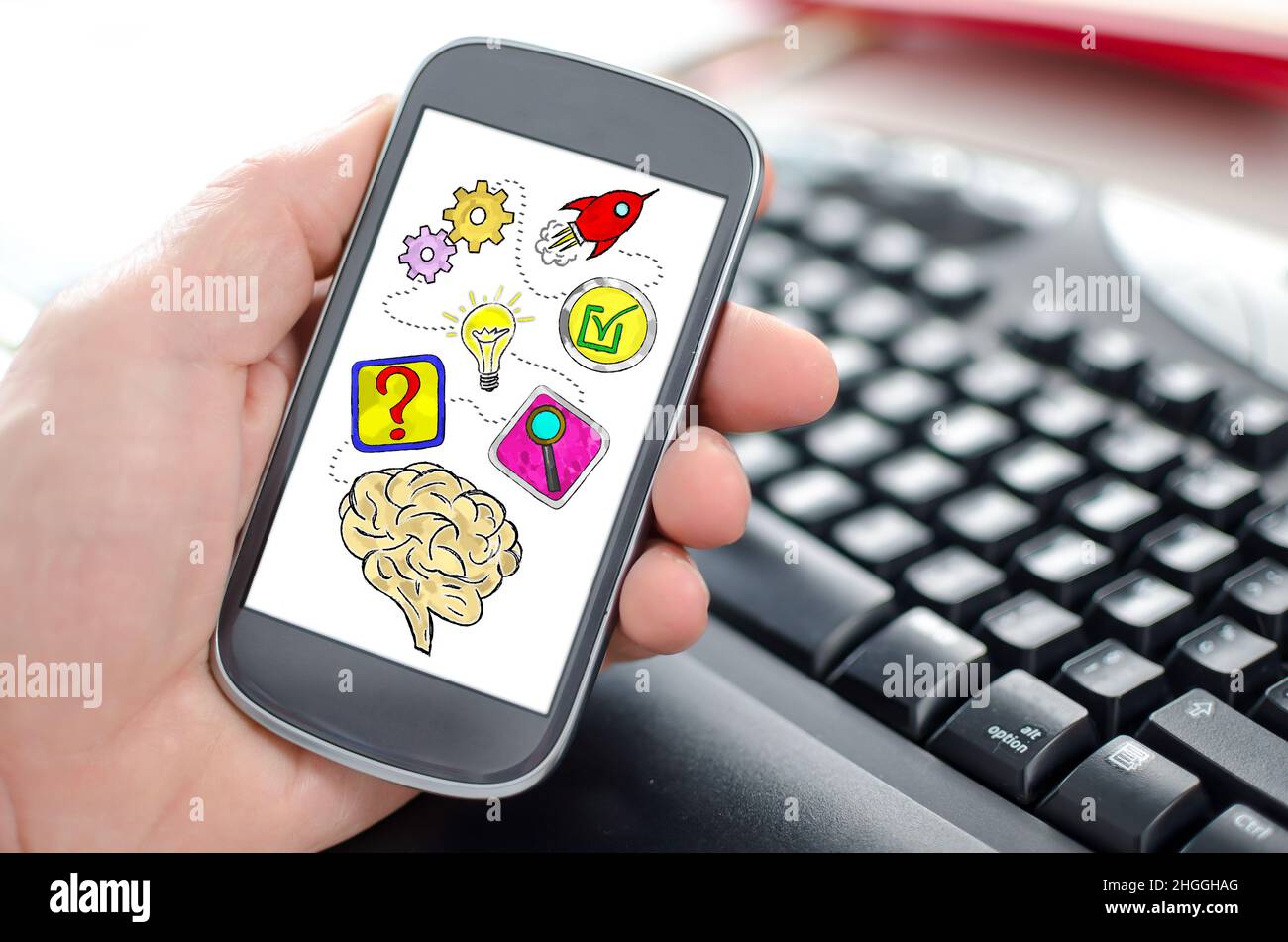 Hand holding a smartphone showing a problem solving concept Stock Photo ...