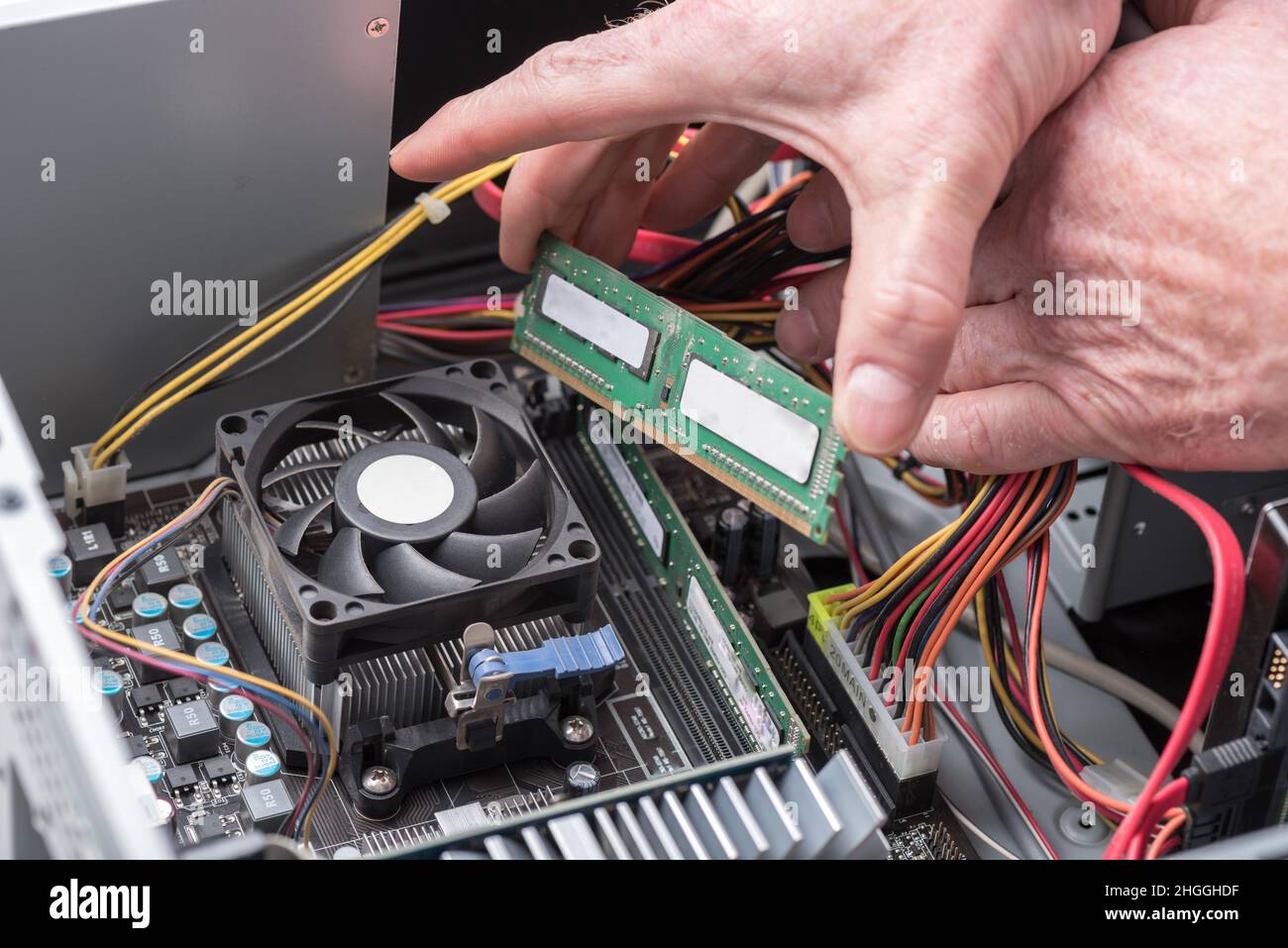 Hands installing ram memory Stock Photo - Alamy