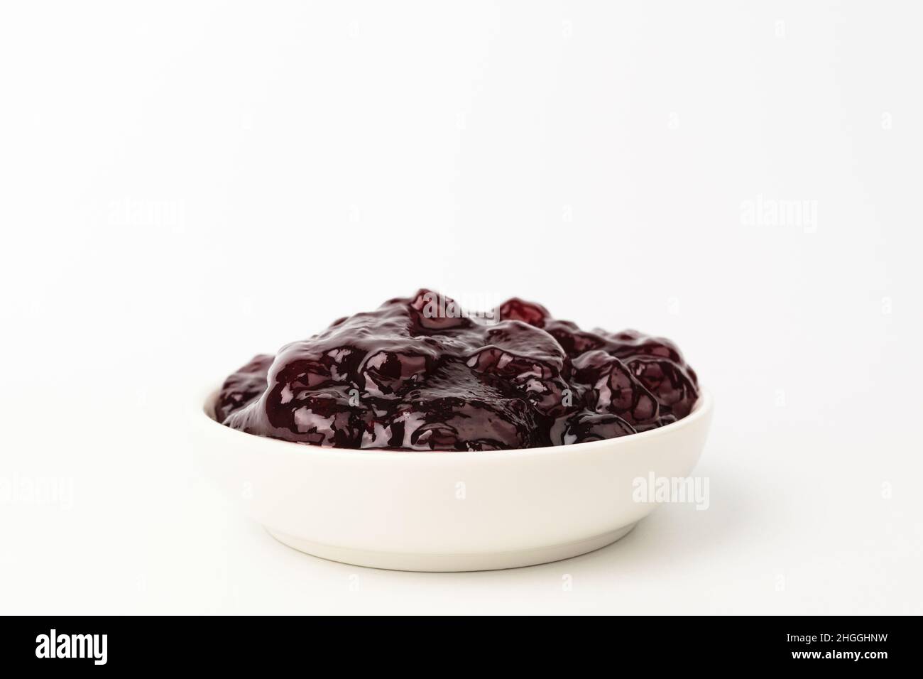 Grape jam on a white background Stock Photo - Alamy